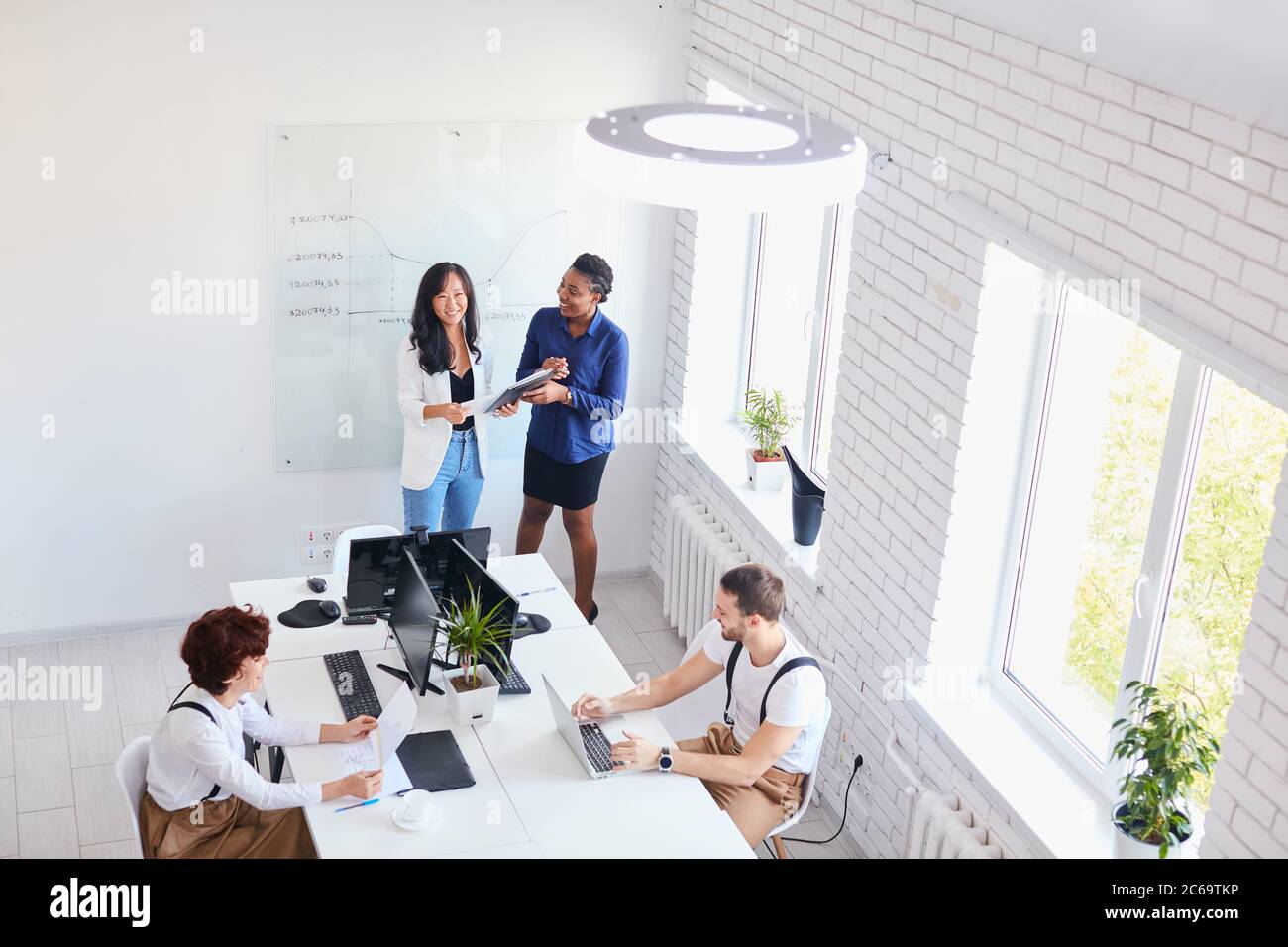 Business for people. Young staff having conversation with african coach ...