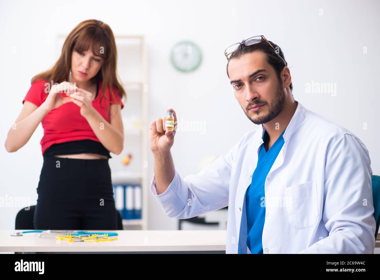 Female diabetic patient visiting young doctor Stock Photo - Alamy