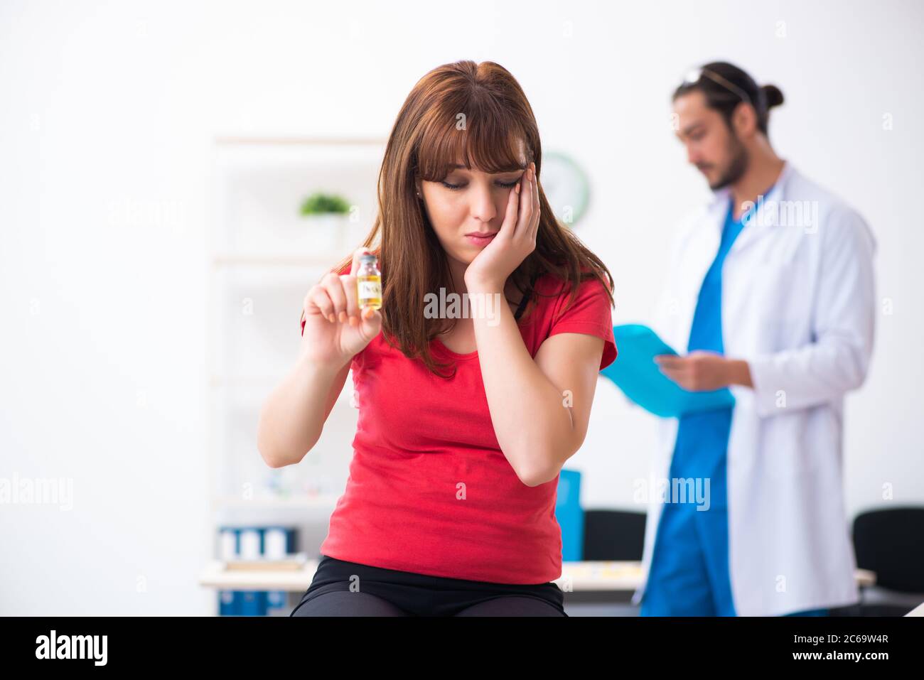 Female diabetic patient visiting young doctor Stock Photo - Alamy