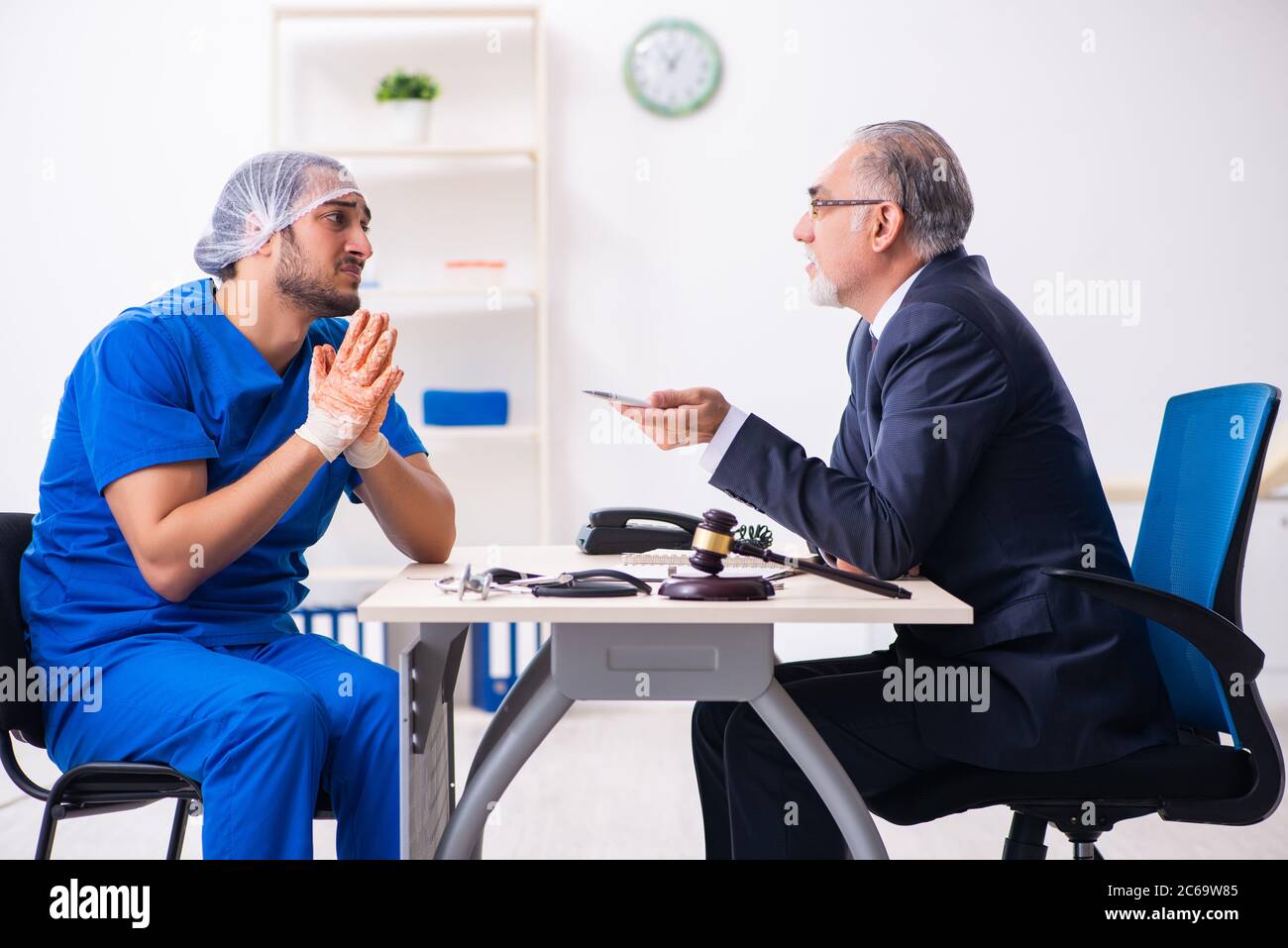 Doctor in courthouse meeting with advocate Stock Photo - Alamy