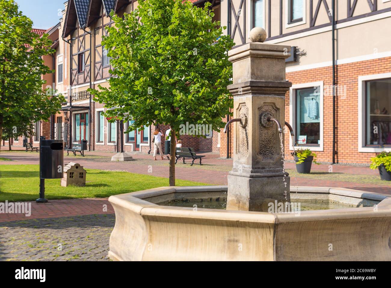 Drinking water fountain on pedestrian street in small european city ...