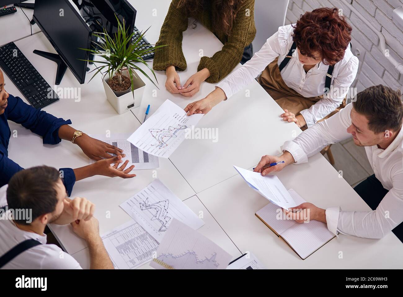 Top view on business team during meeting conference working with ...