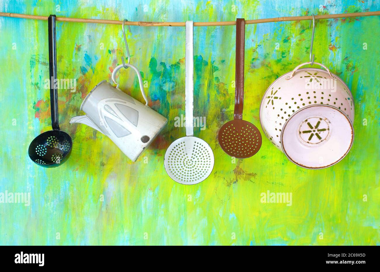 old enamel kitchen utensils, good copy space Stock Photo - Alamy