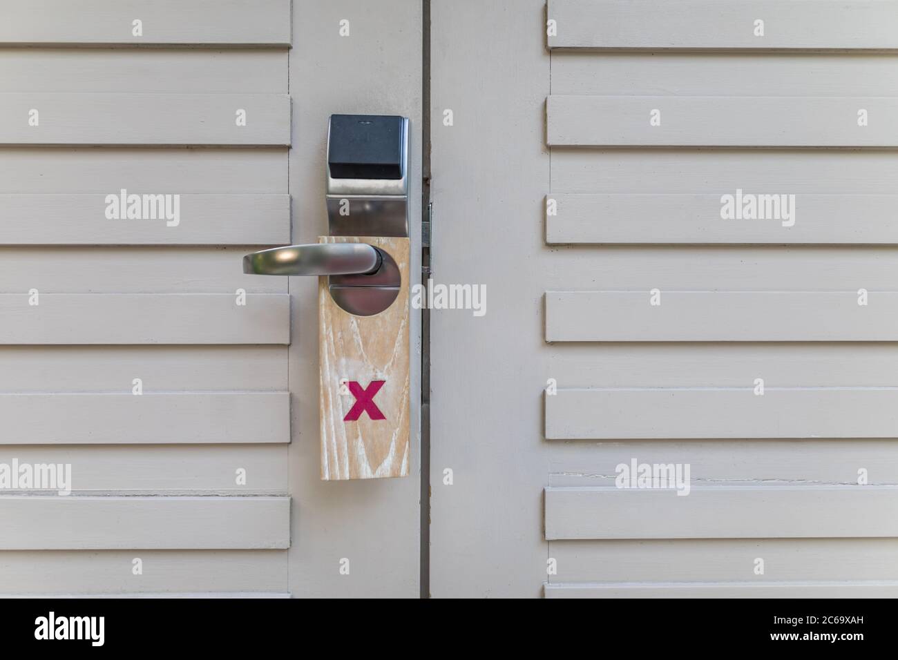 Do not disturb sign on hotel resort door. Wooden sign for privacy Stock ...