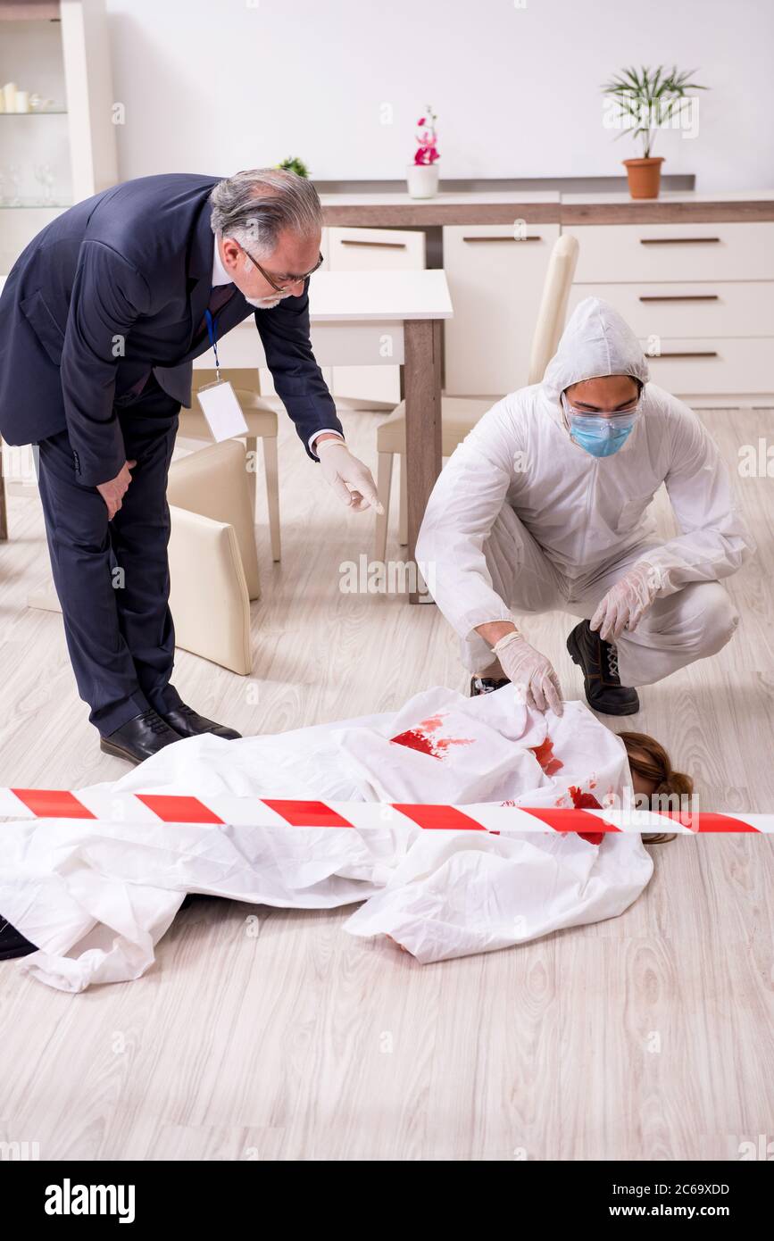 Forensic experts at the crime scene at home Stock Photo - Alamy