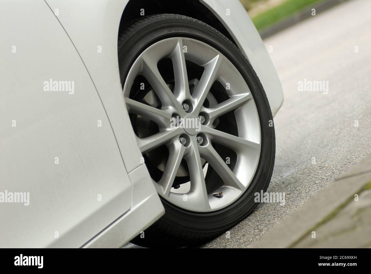 tire and alloy wheel on a passenger car Stock Photo - Alamy