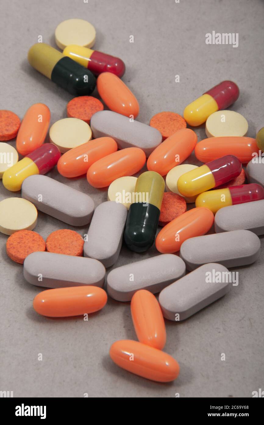 Colored tablets and capsules are removed from the package. Colored ...
