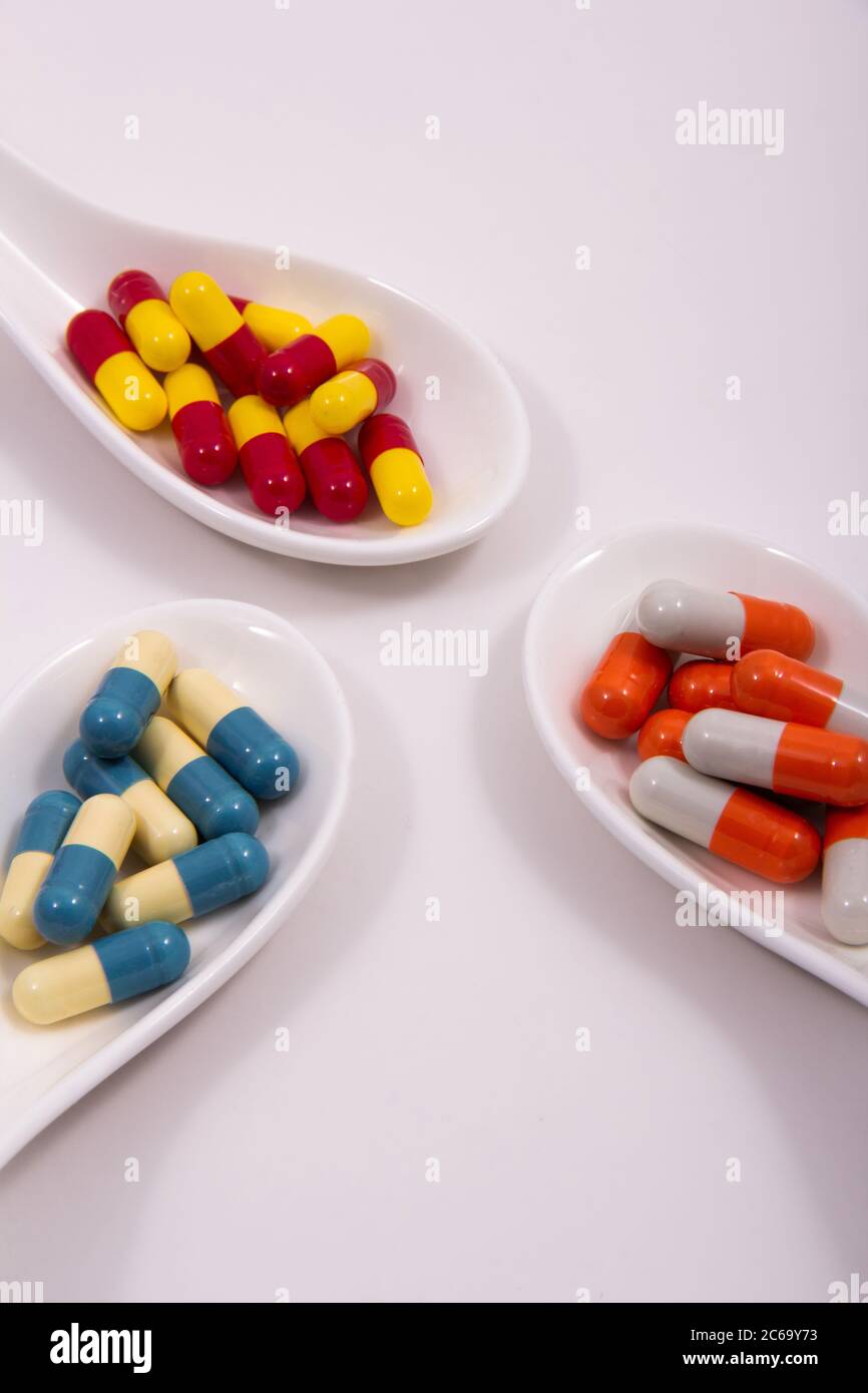 Color capsules out of cover. Color capsules with a simple background ...