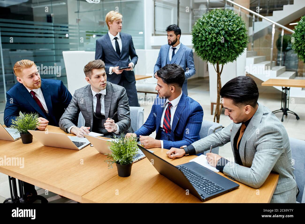 Smart energetic men of different appearance, different nationalities ...