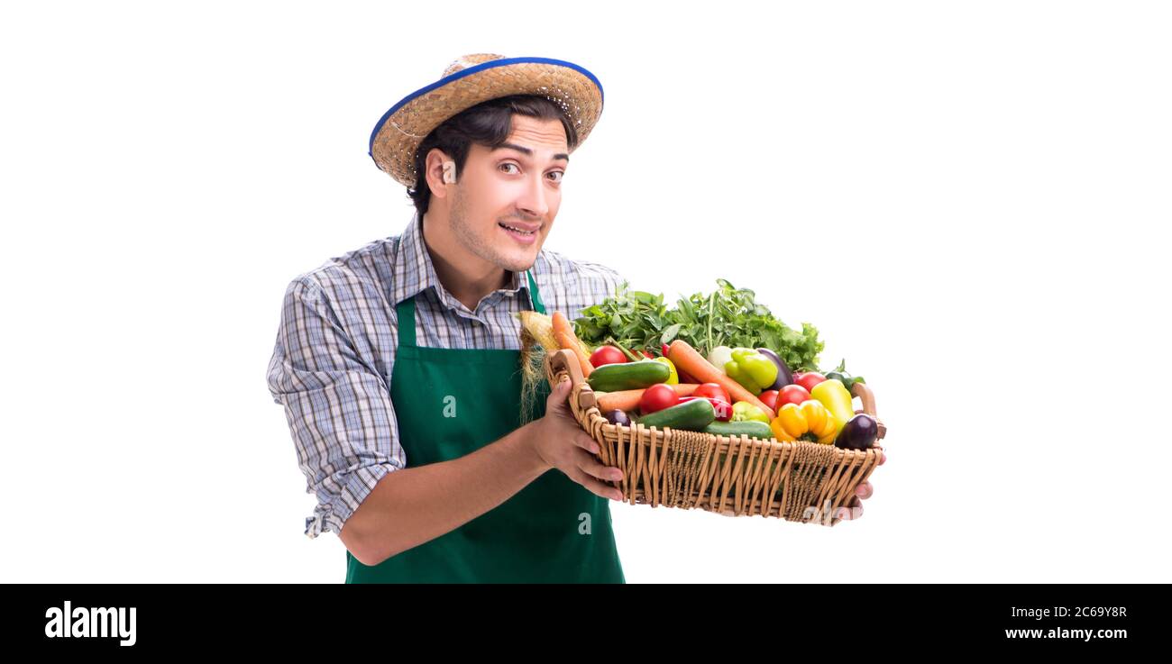 The young farmer with fresh produce isolated on white background Stock ...
