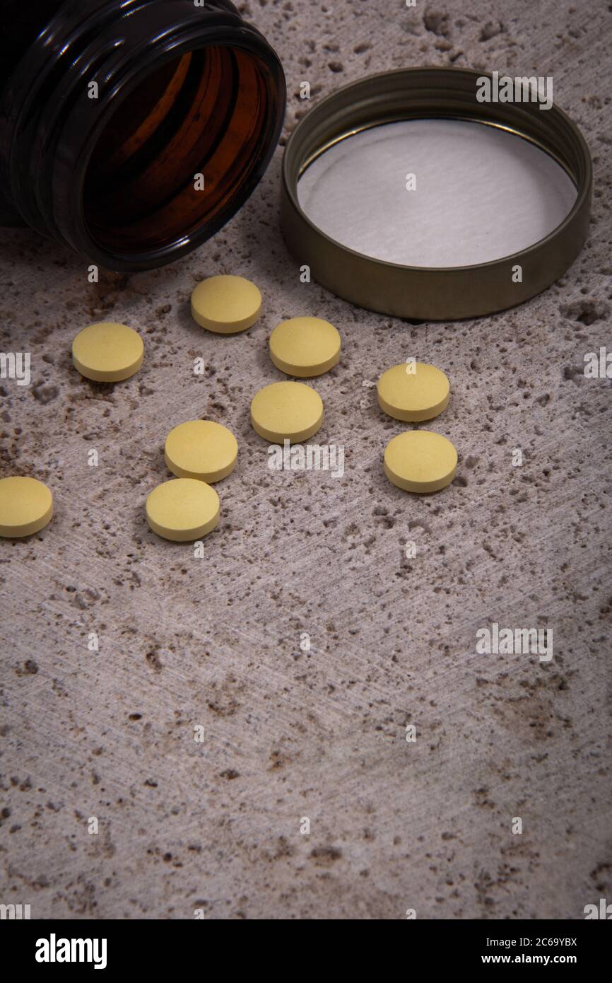 Colored tablets out of the package. Colored pills with a simple ...