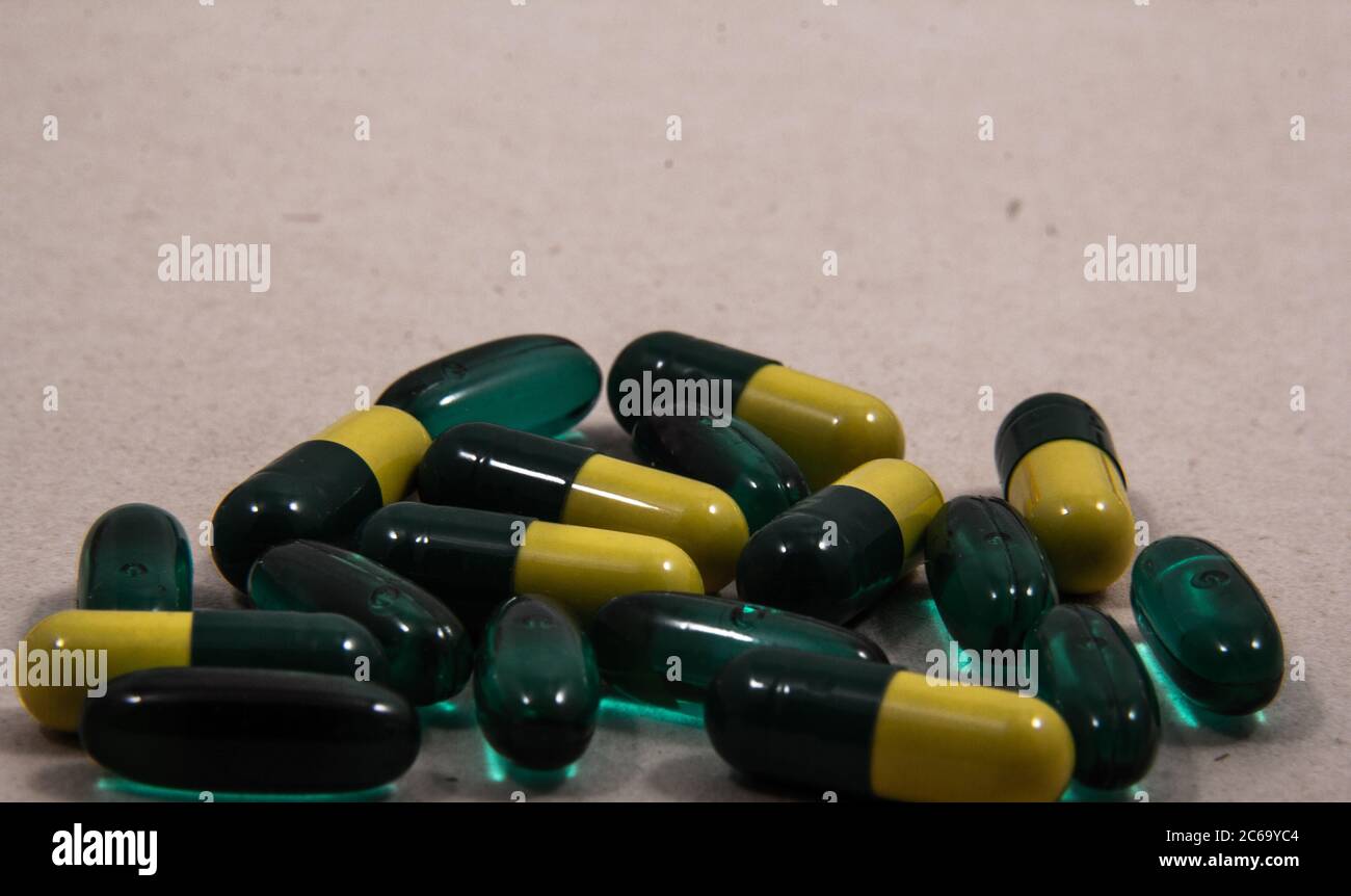 Color capsules out of cover. Color capsules with a simple background ...