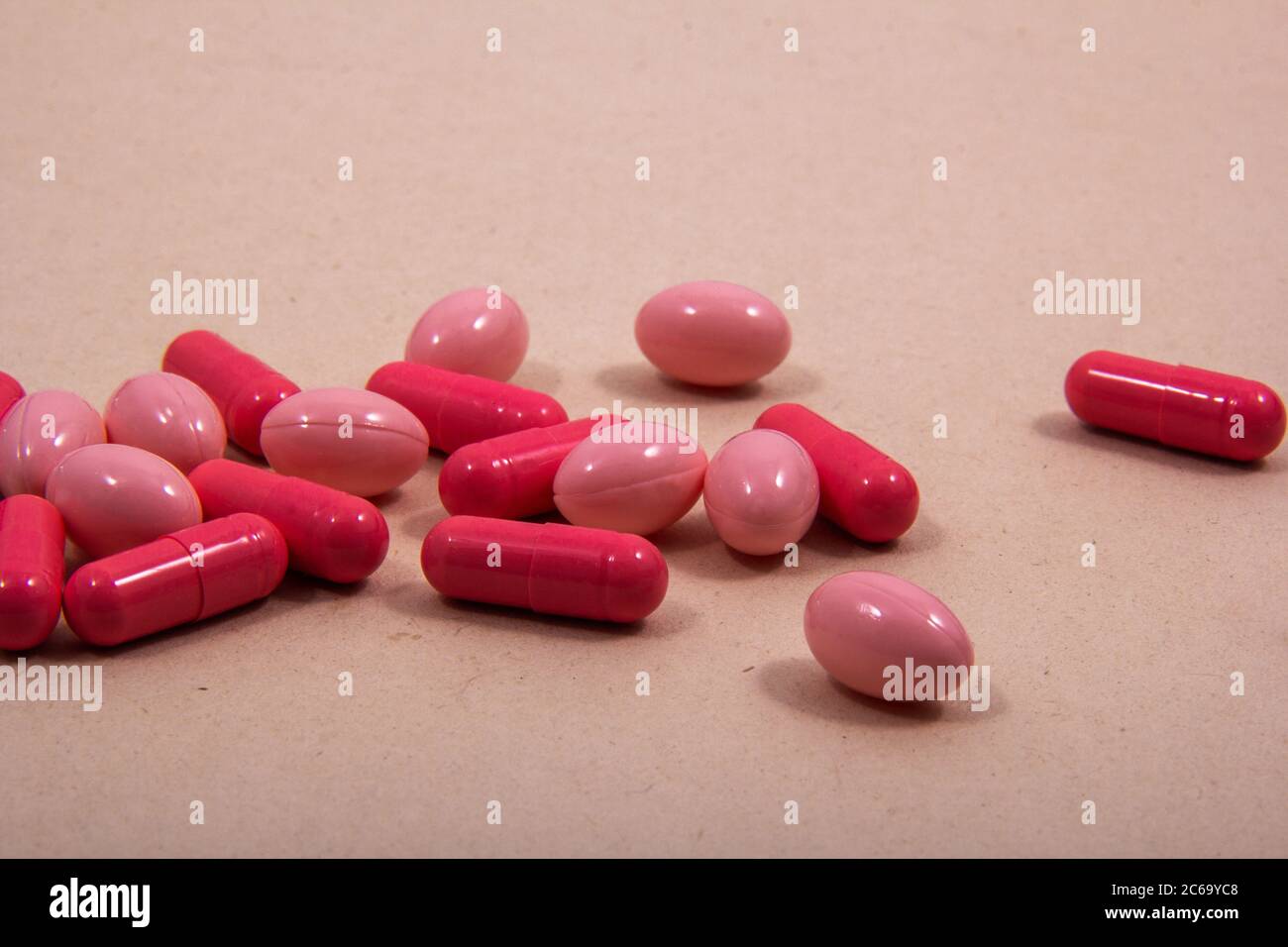 Colored tablets and capsules out of the cover. Arrange colored tablets ...