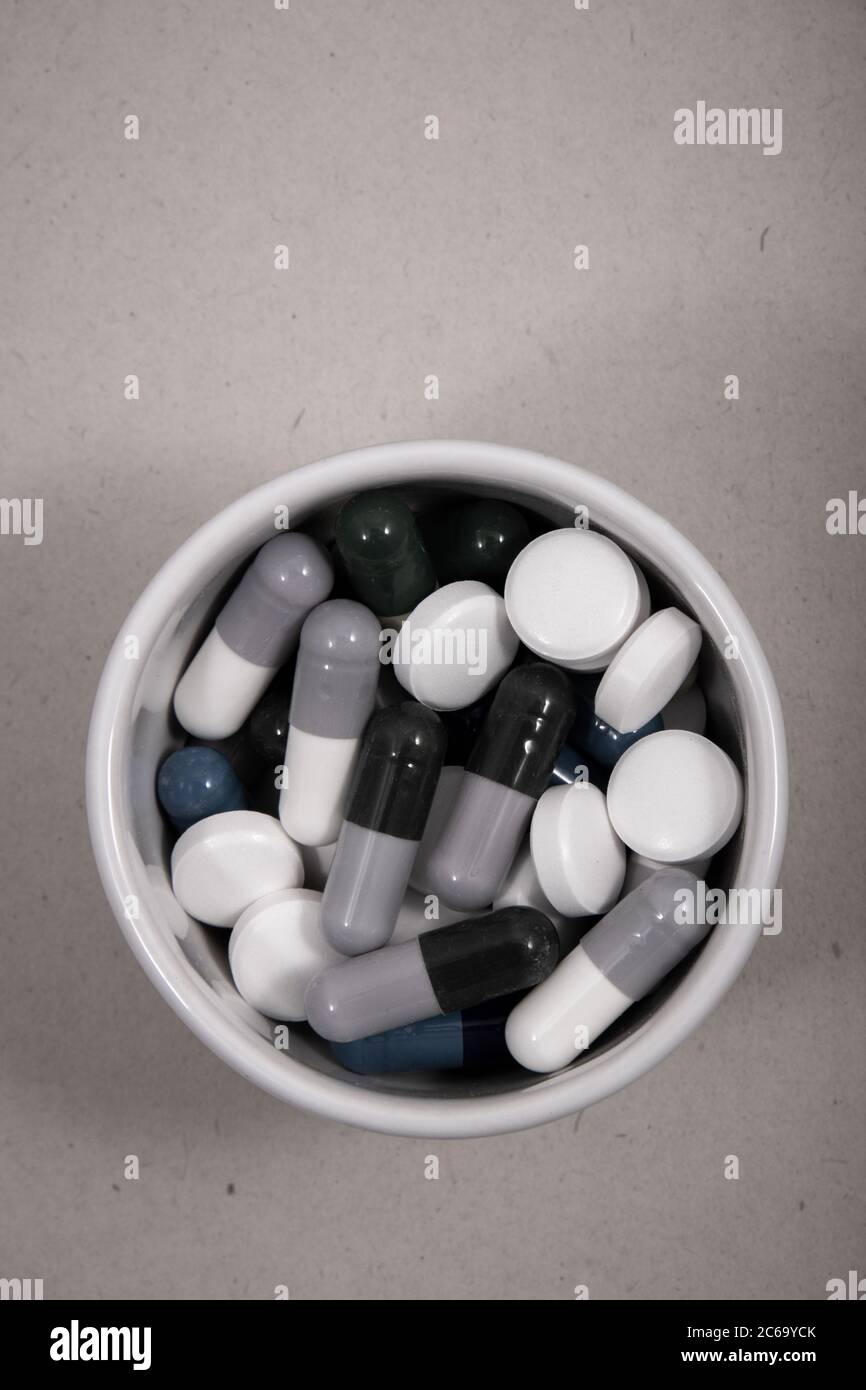 Colored tablets and capsules are removed from the package. Colored ...