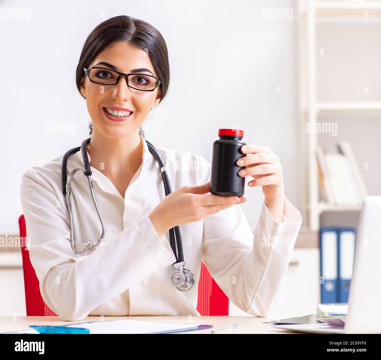 The woman doctor with bottle of medicines Stock Photo - Alamy