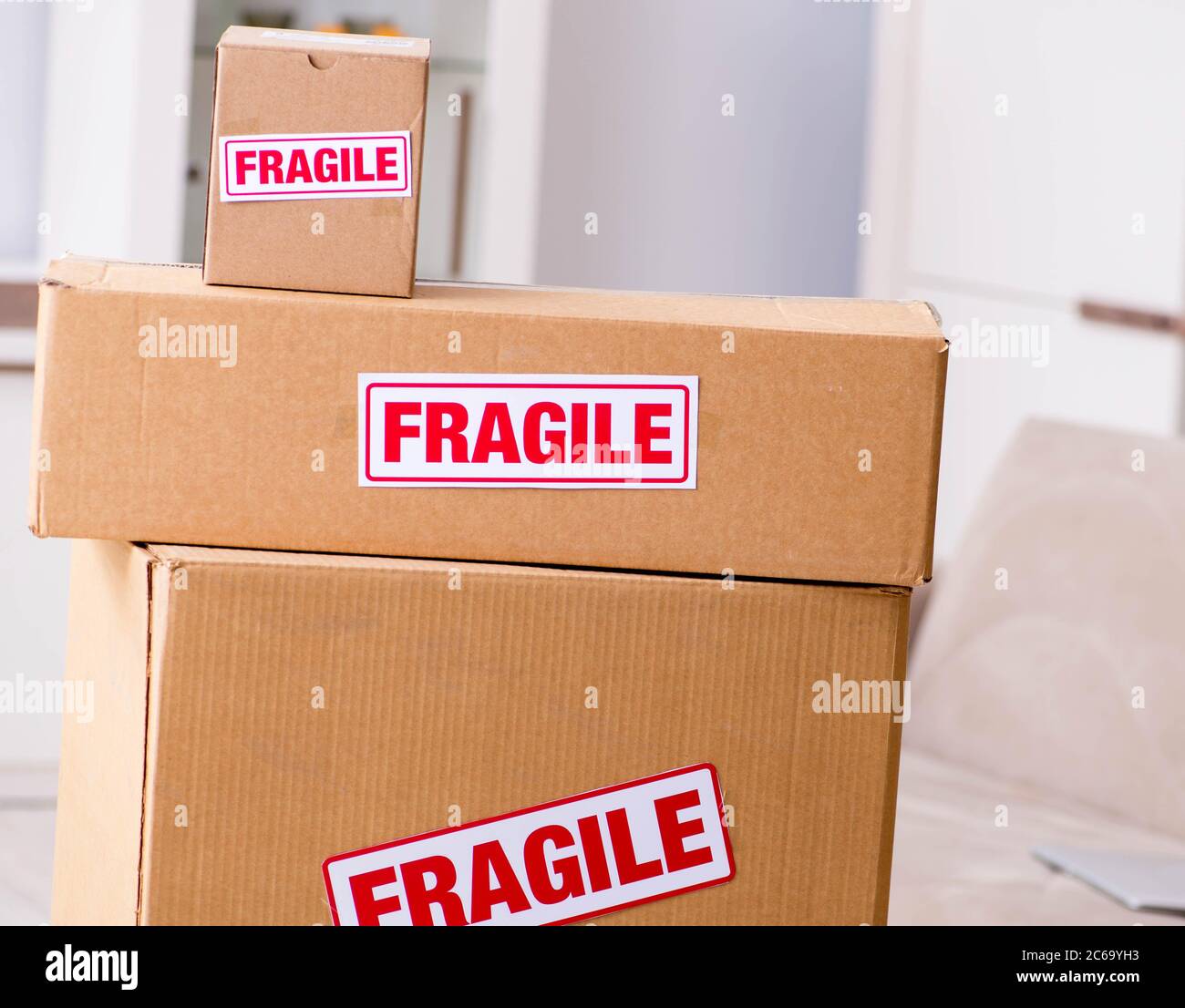 The transportation contractor with fragile boxes Stock Photo - Alamy