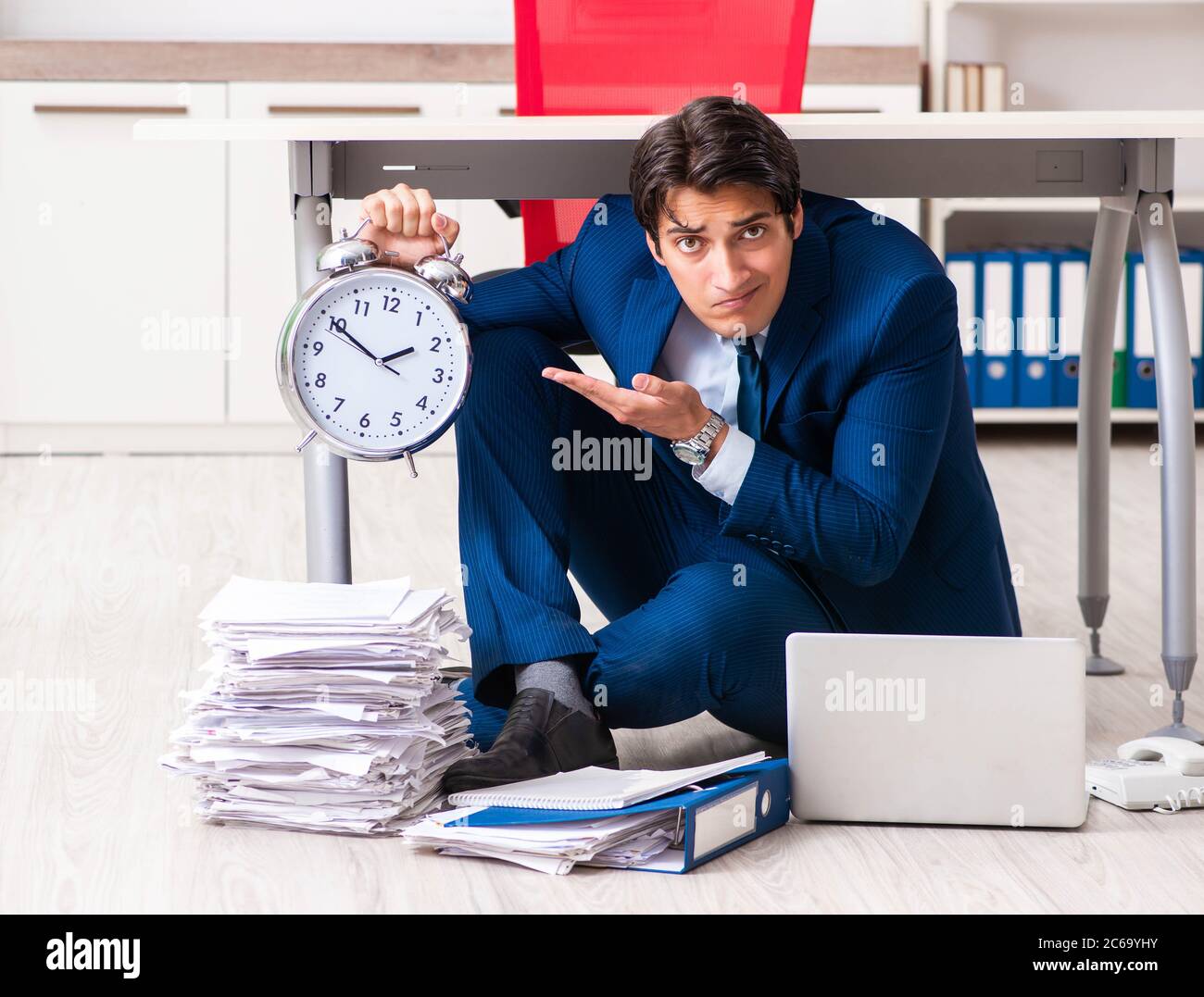 The tired exhausted businessman working overtime in office Stock Photo ...