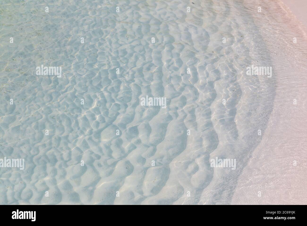 Clear water surface with white sand Stock Photo - Alamy