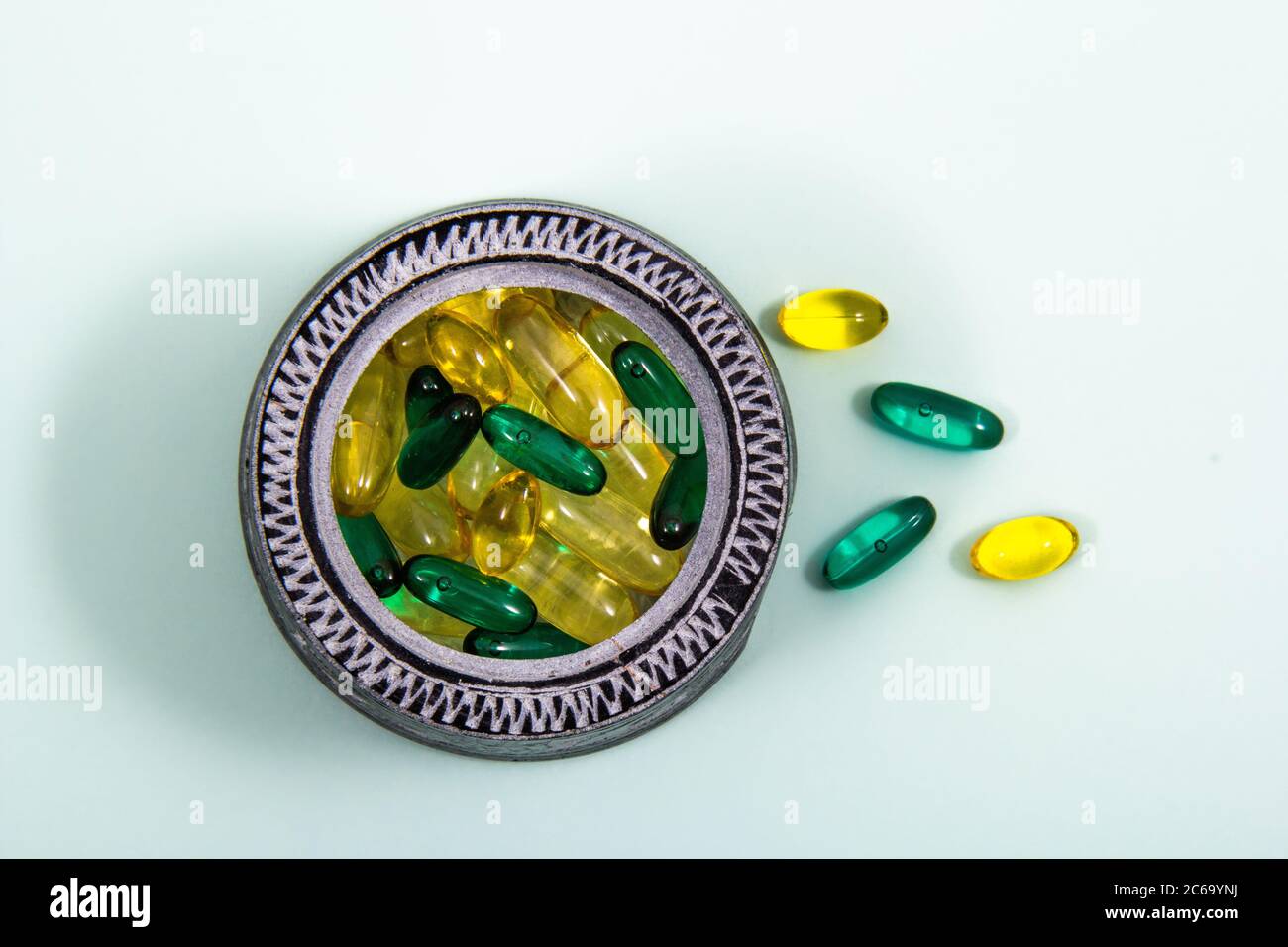 Color capsules out of cover. Color capsules with a simple background ...