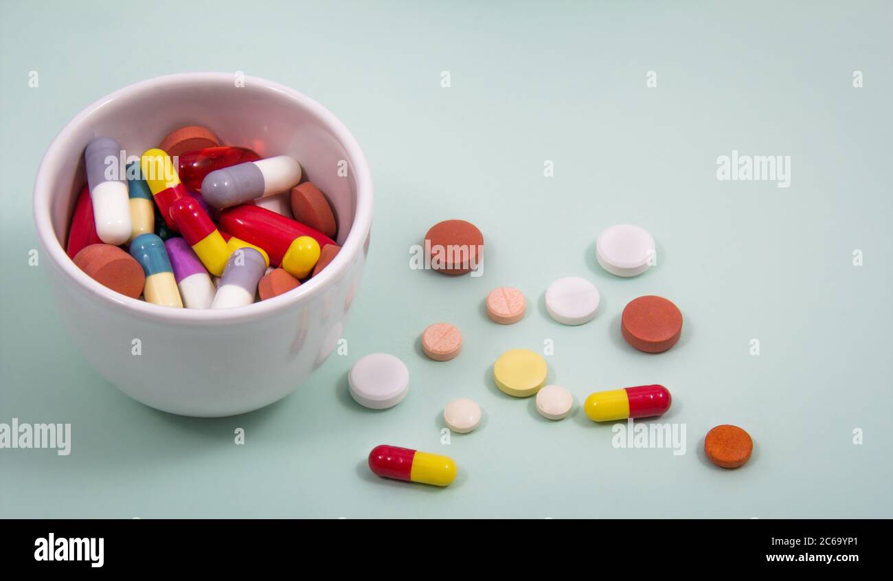 Colored tablets and capsules are removed from the package. Colored ...
