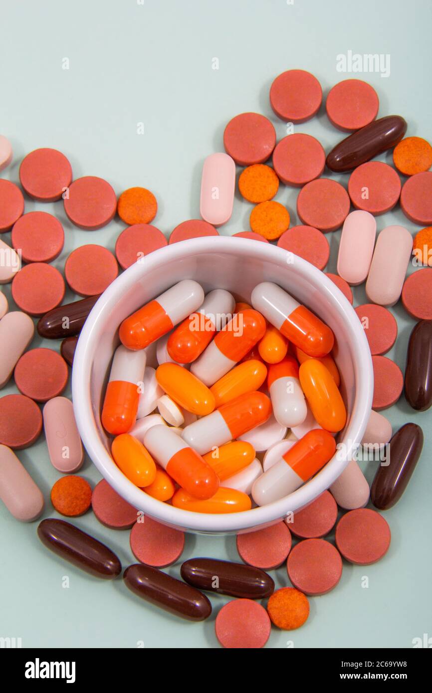 Colored tablets and capsules are removed from the package. Colored ...