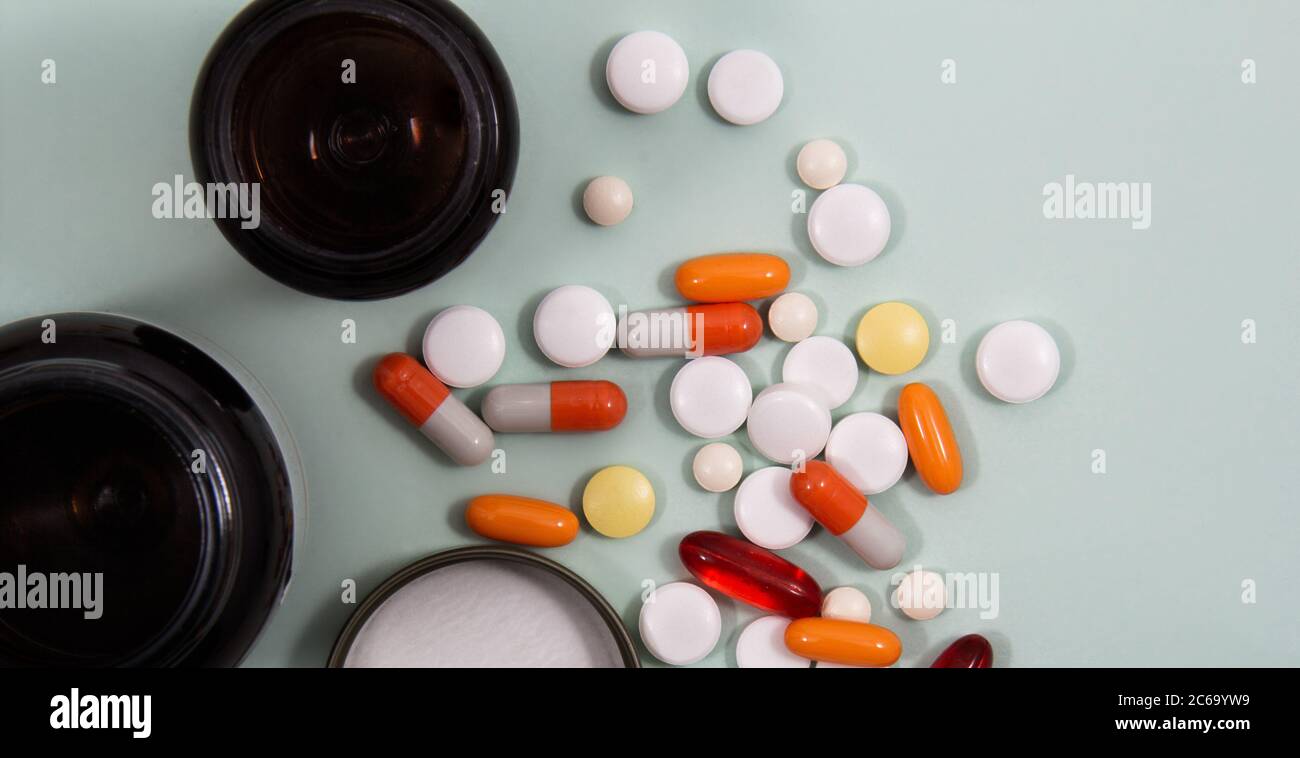 Colored tablets and capsules are removed from the package. Colored ...