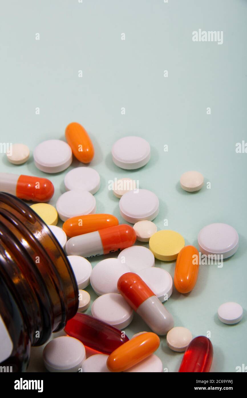 Colored tablets and capsules are removed from the package. Colored ...