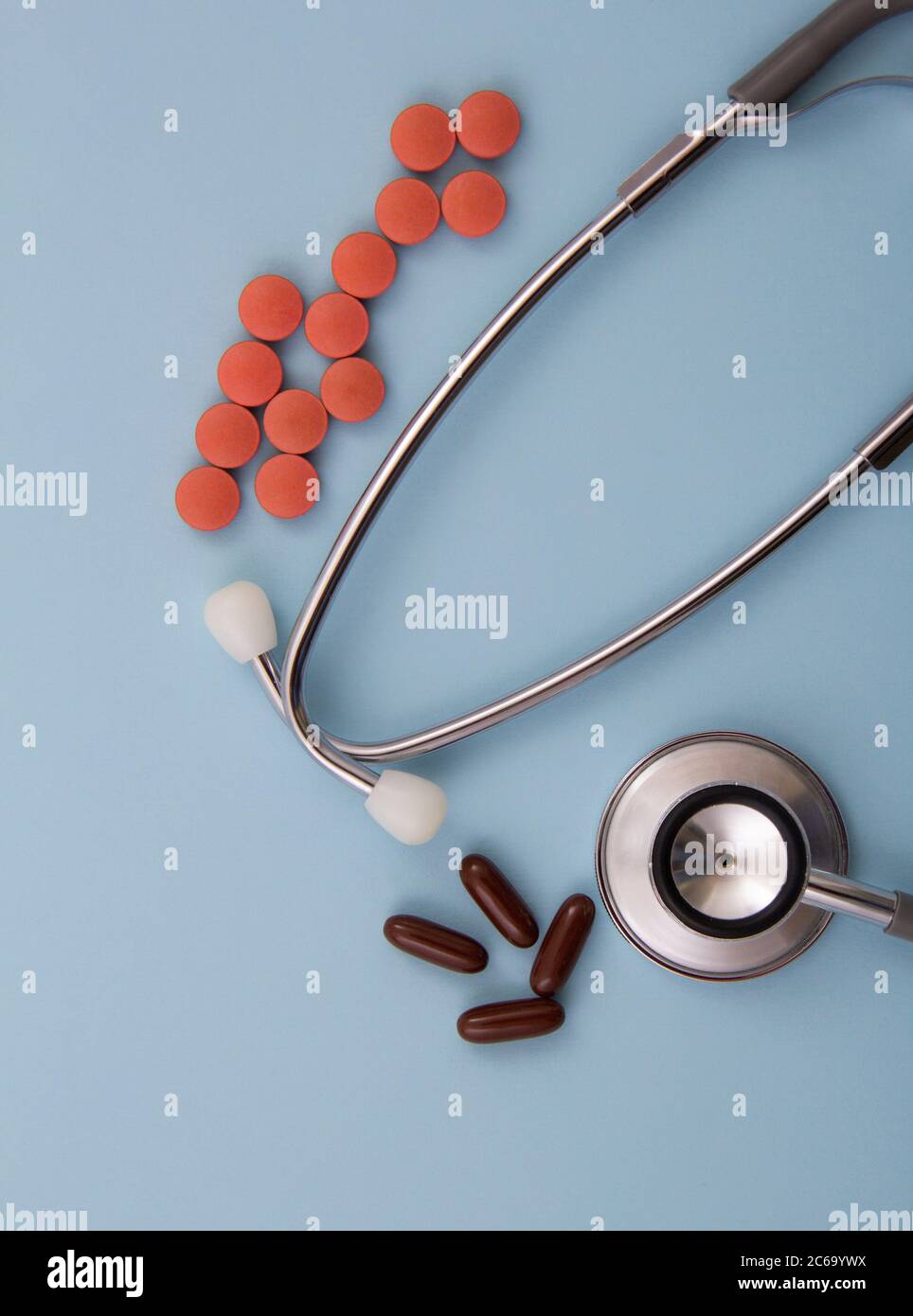 Colored tablets and capsules out of the package. Colored tablets and ...