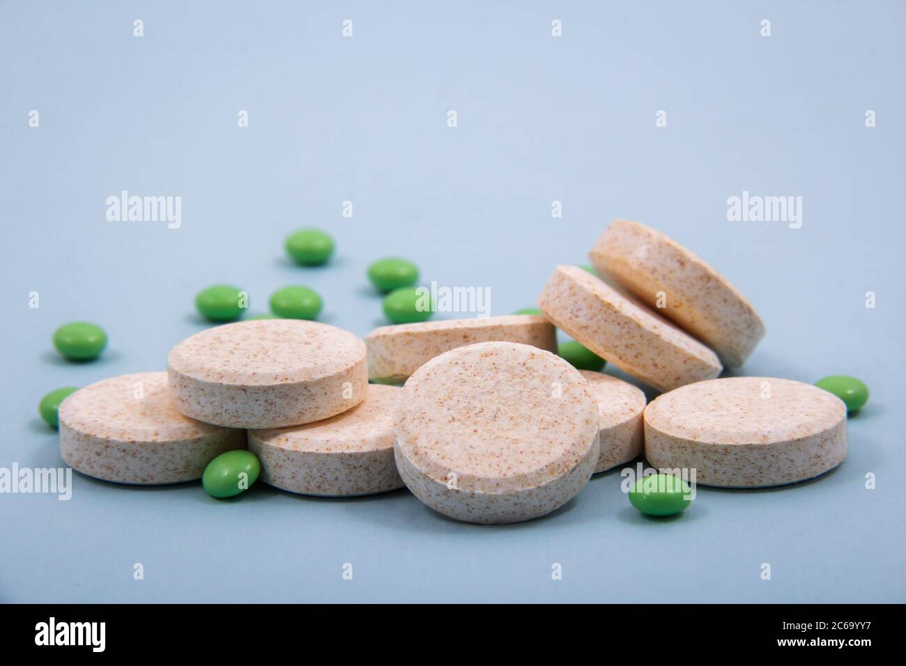 Colored tablets out of the package. Colored pills with a simple ...