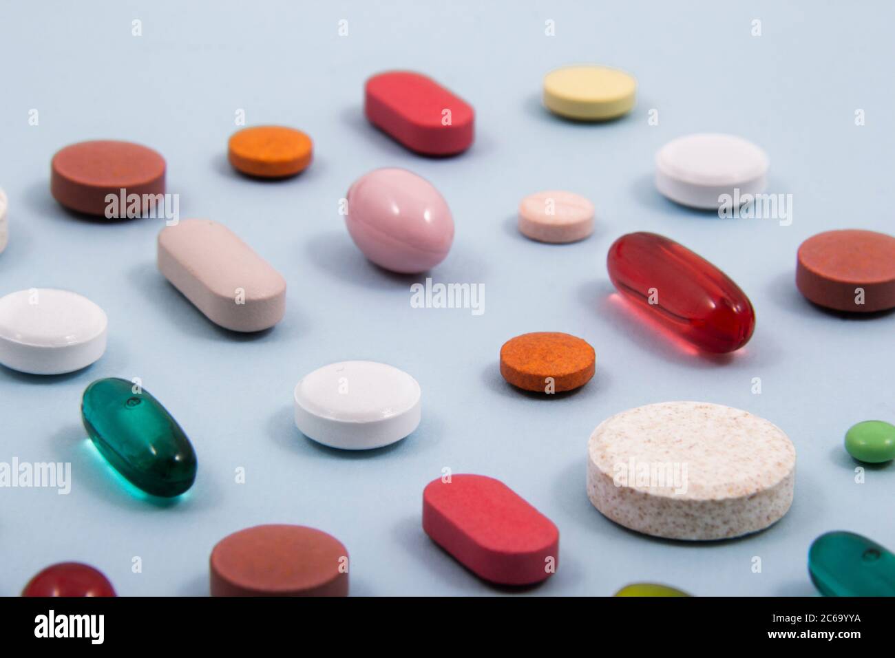 Colored tablets and capsules are removed from the package. Colored ...