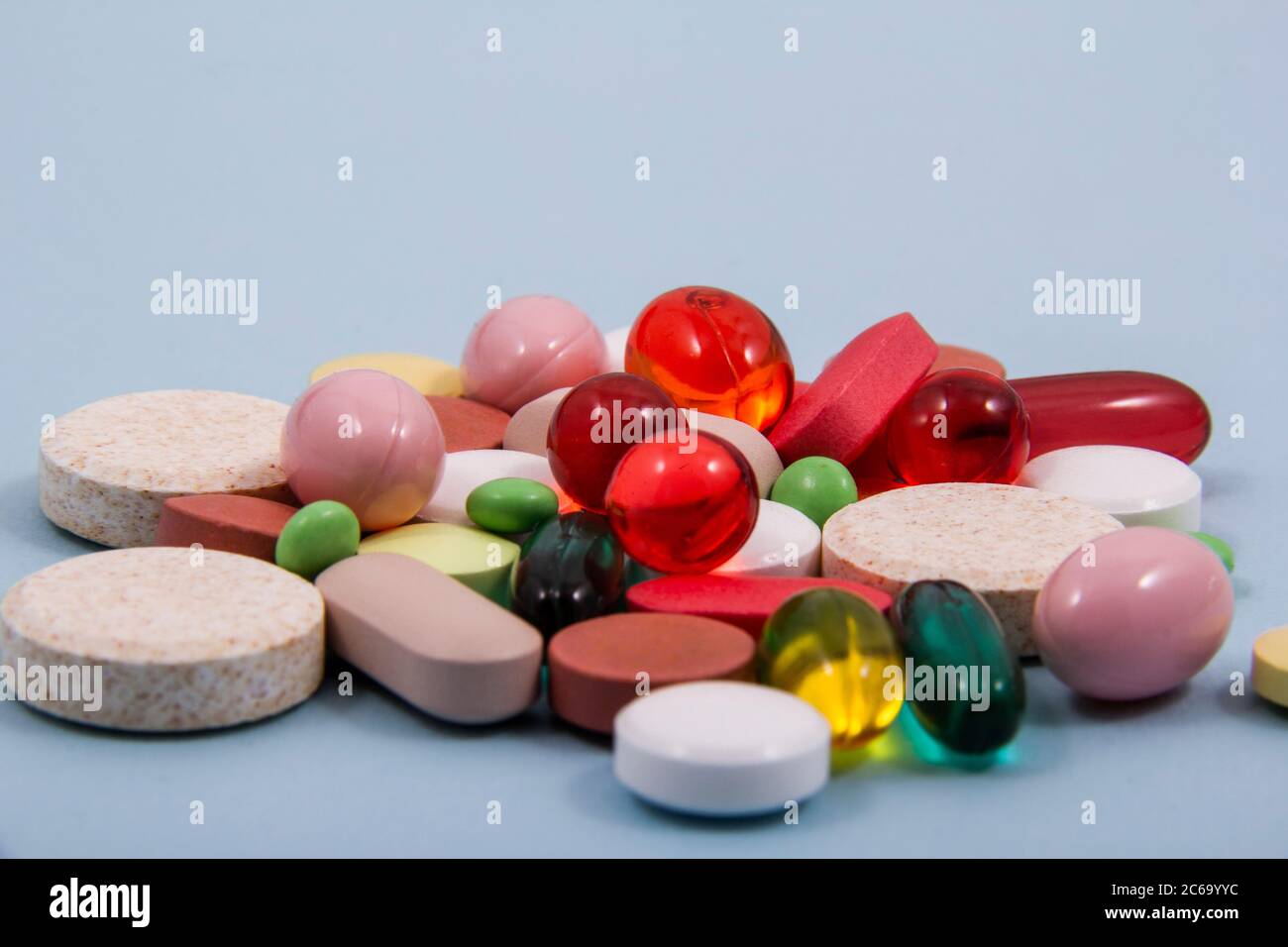 Colored tablets and capsules are removed from the package. Colored ...