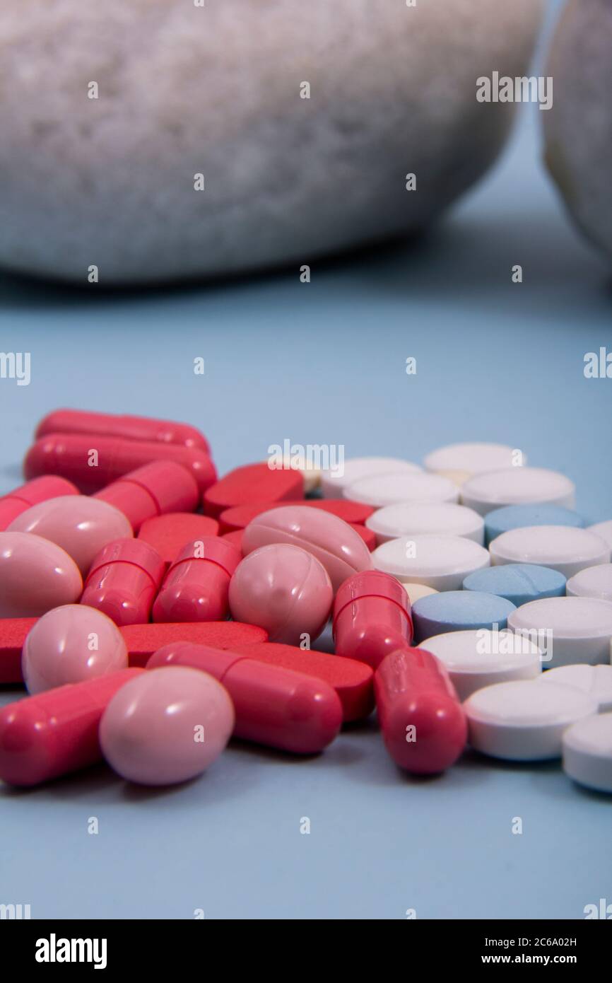 Colored tablets and capsules are removed from the package. Colored ...