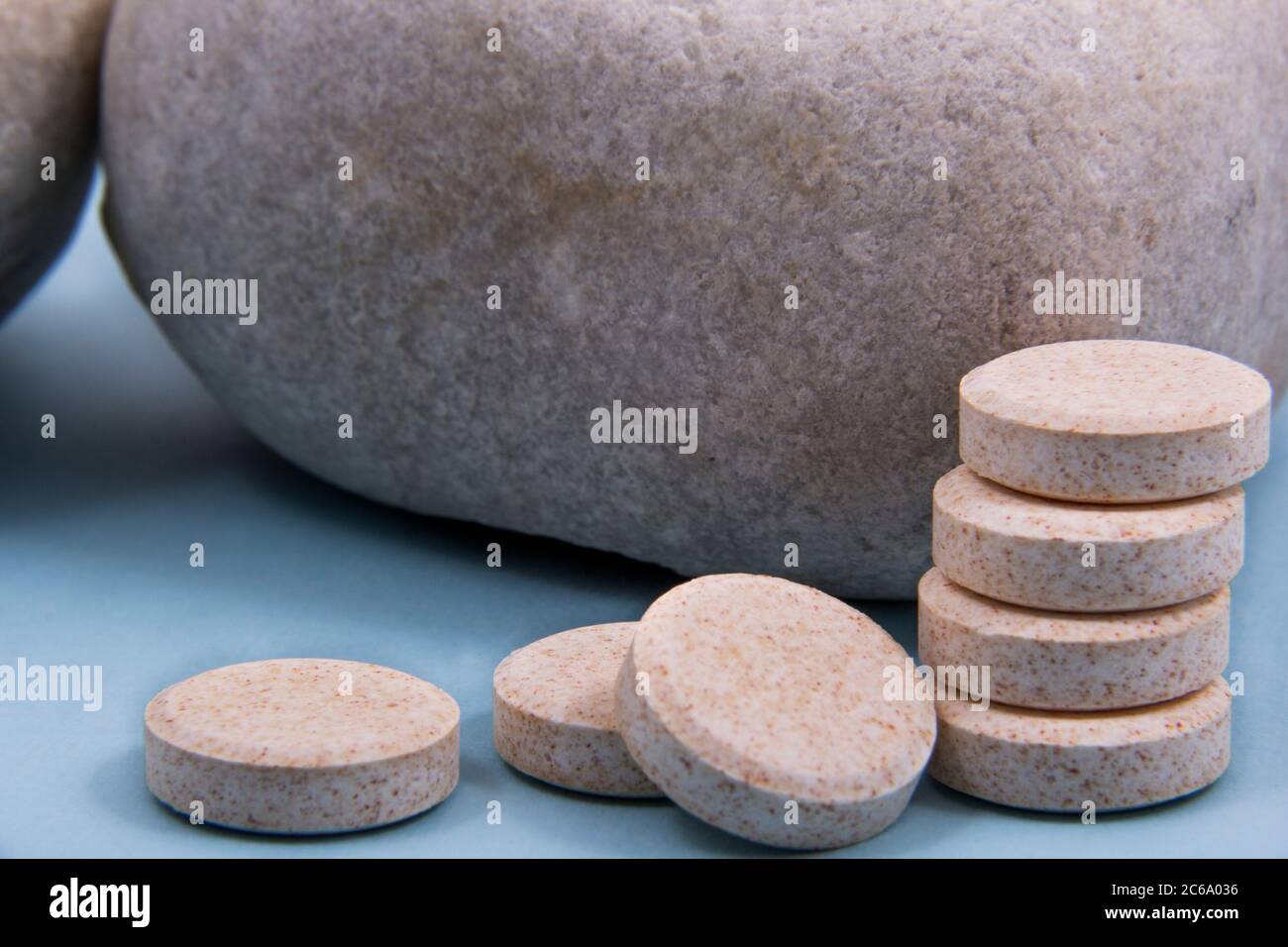 Colored tablets out of the package. Colored pills with a simple ...