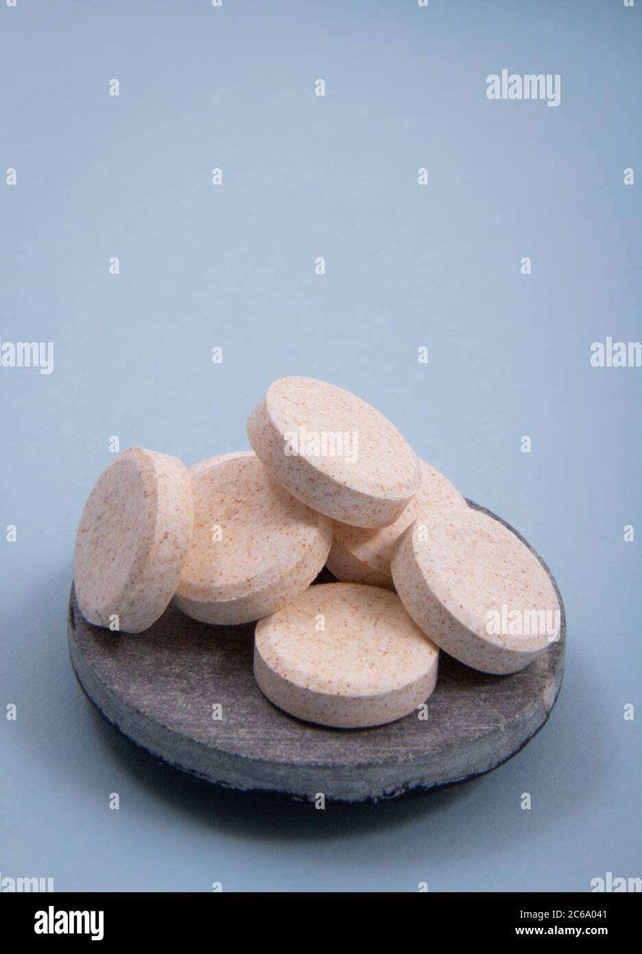 Colored tablets out of the package. Colored pills with a simple ...