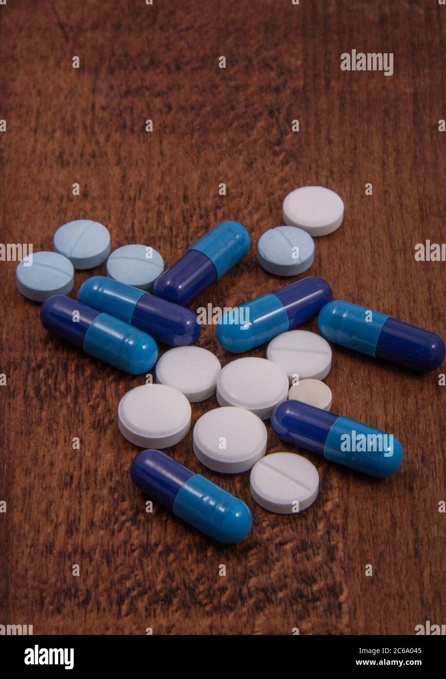 Colored tablets and capsules are removed from the package. Colored ...