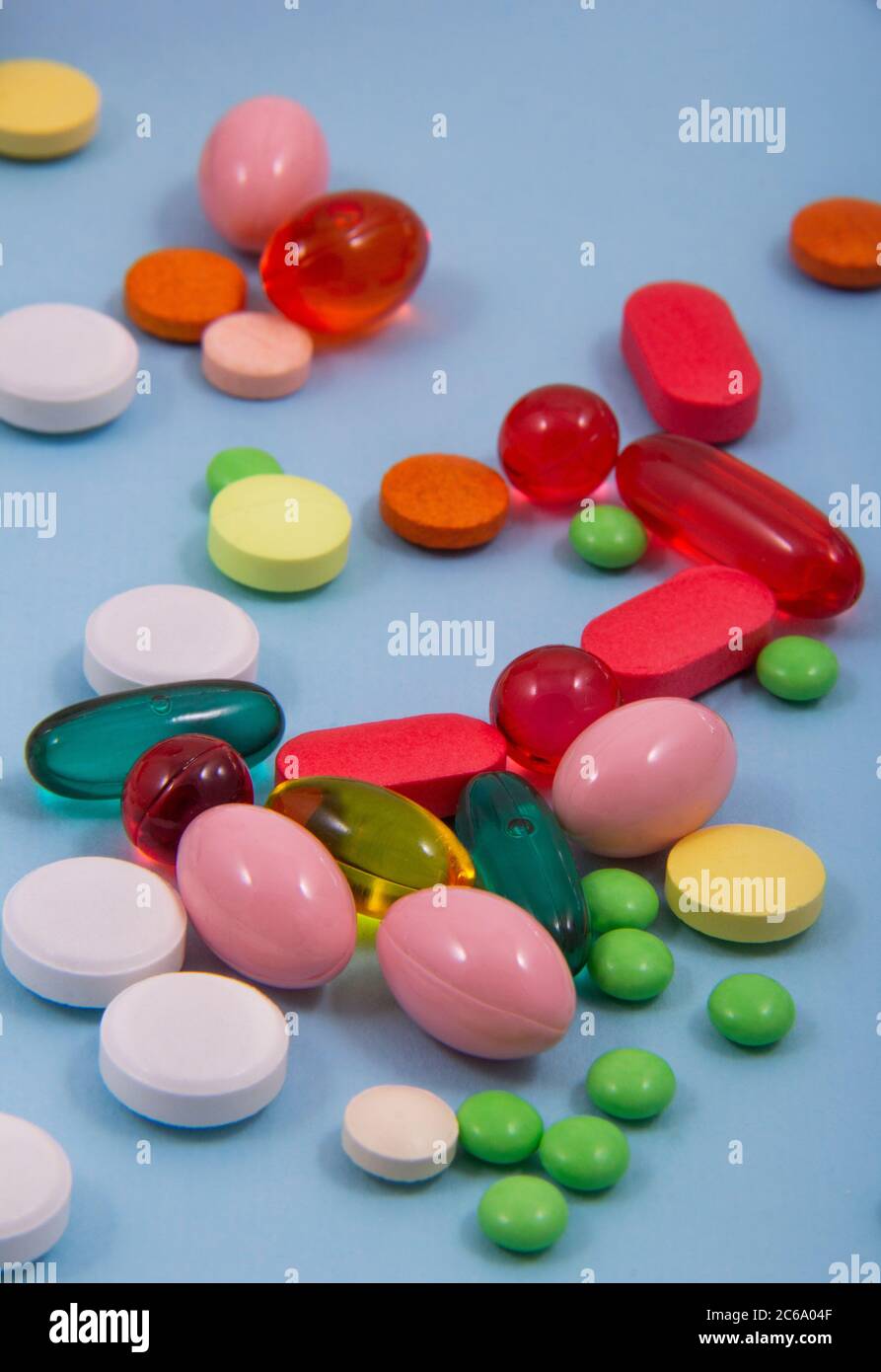 Colored tablets and capsules are removed from the package. Colored ...