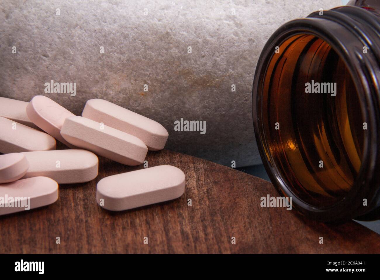 Some white capsules. Capsules together in one container or out of ...