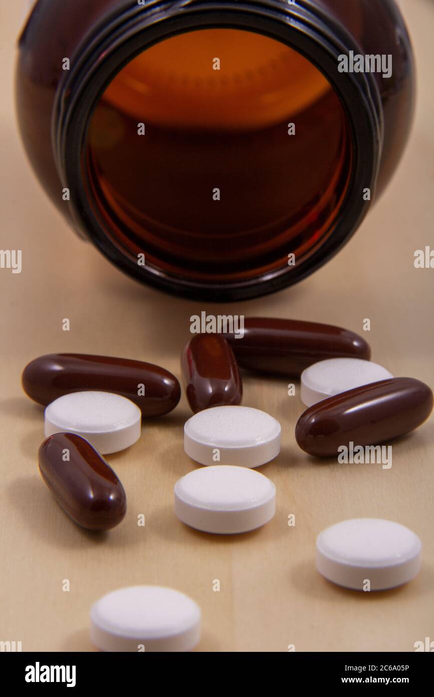 Colored tablets and capsules are removed from the package. Colored ...