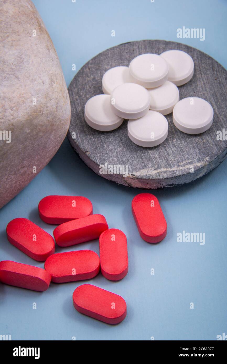 Colored tablets and capsules are removed from the package. Colored ...