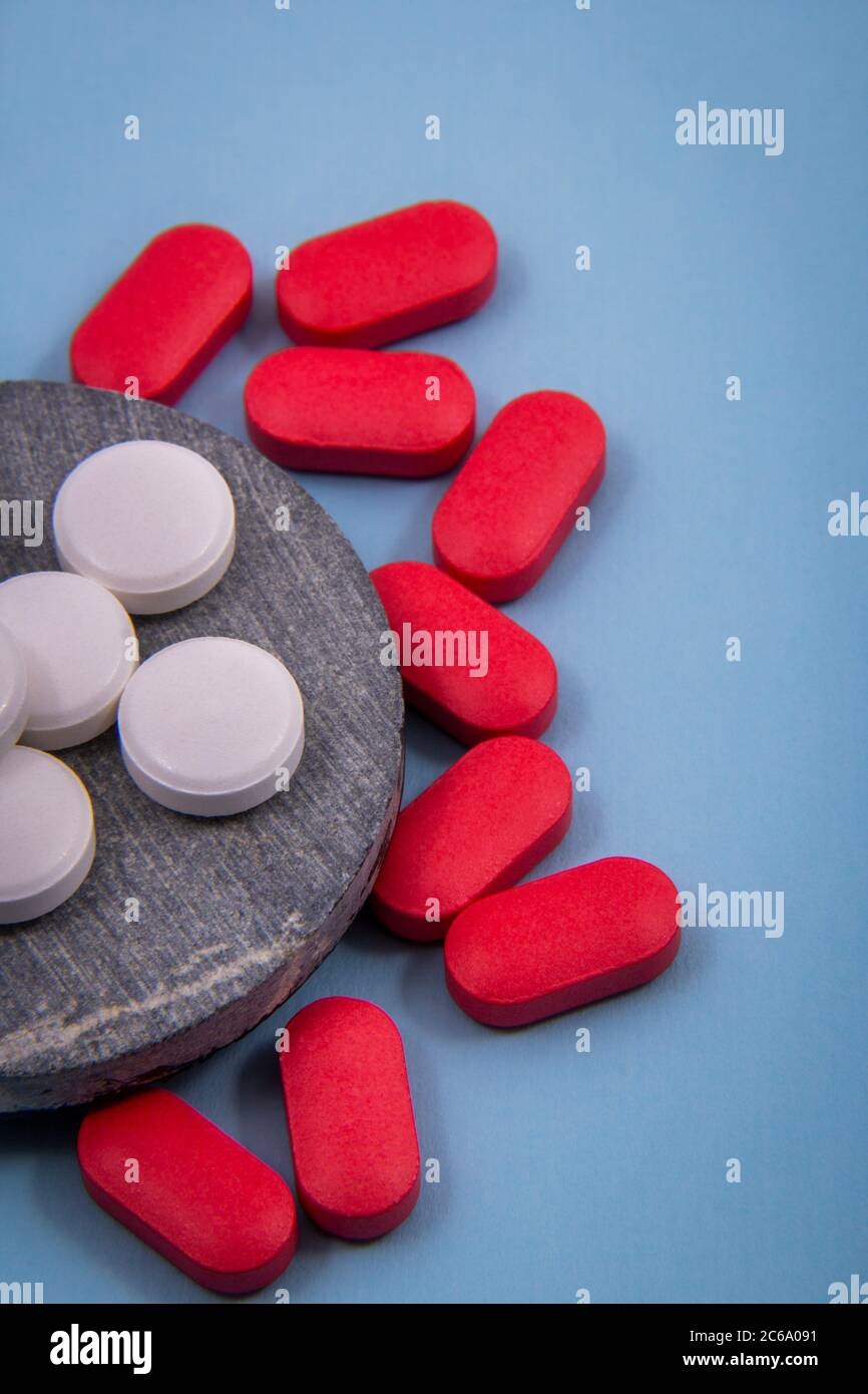 Colored tablets and capsules are removed from the package. Colored ...