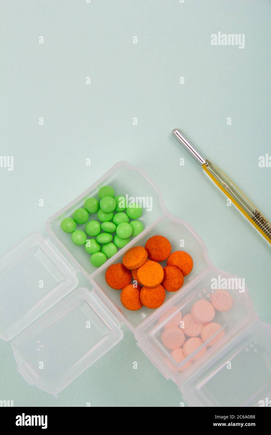 Colored tablets and capsules out of the package. Colored tablets and ...