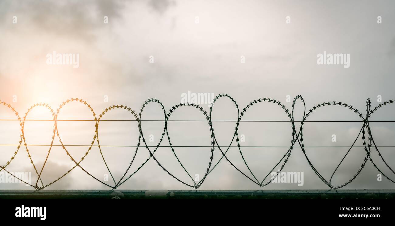 Prison security fence. Barbed wire security fence. Razor wire jail ...