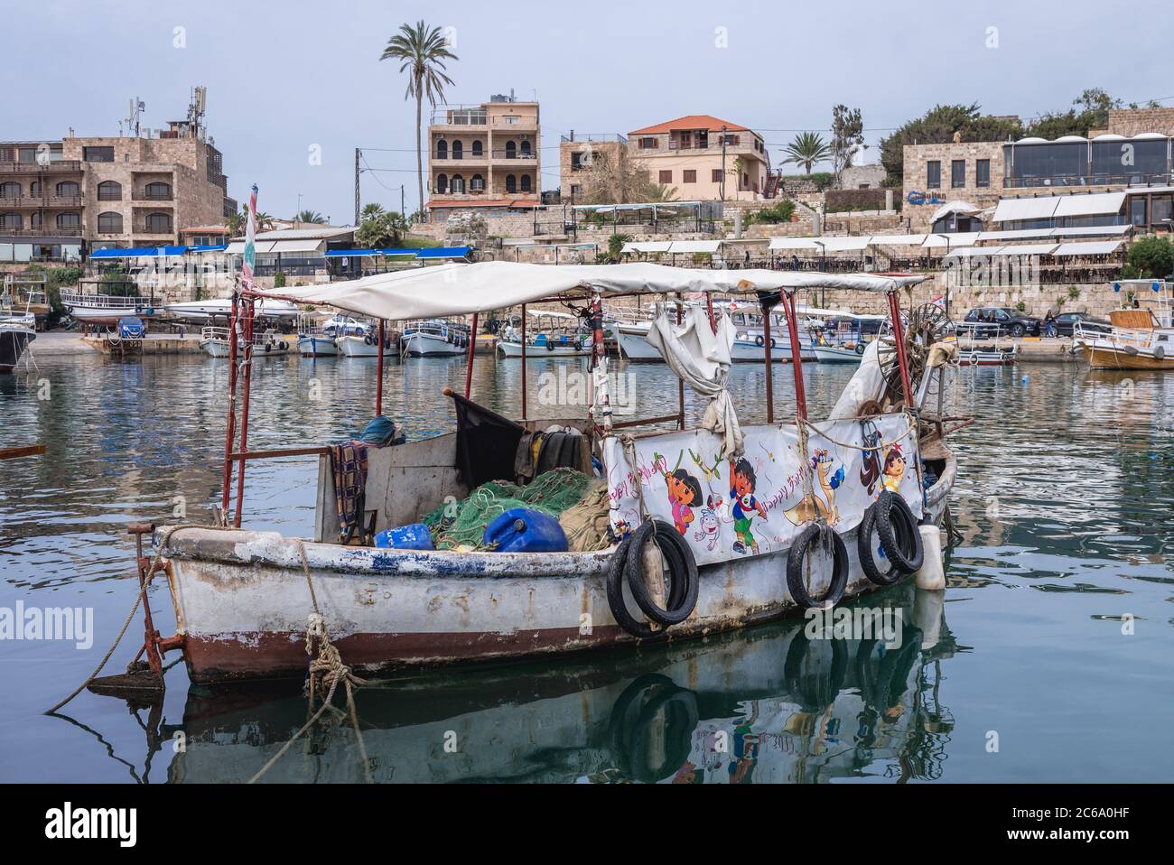 Old fishing boat in harbour of Byblos, largest city in the Mount ...