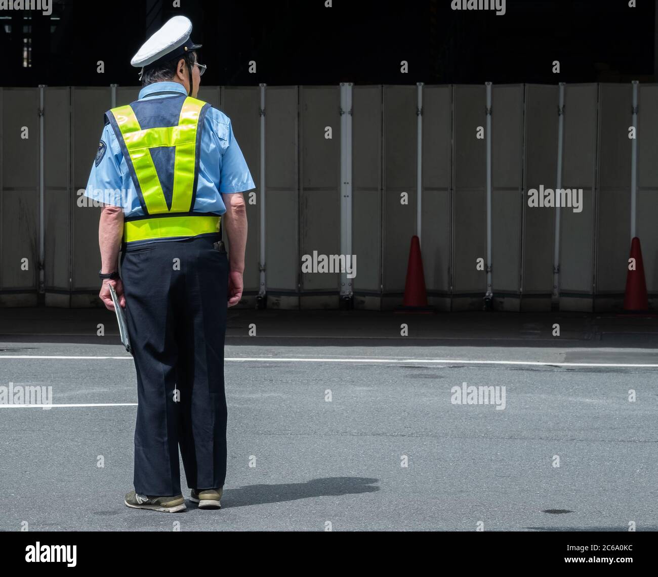 Traffic guide standing in the middle of Shibuya Street, Tokyo, Japan ...