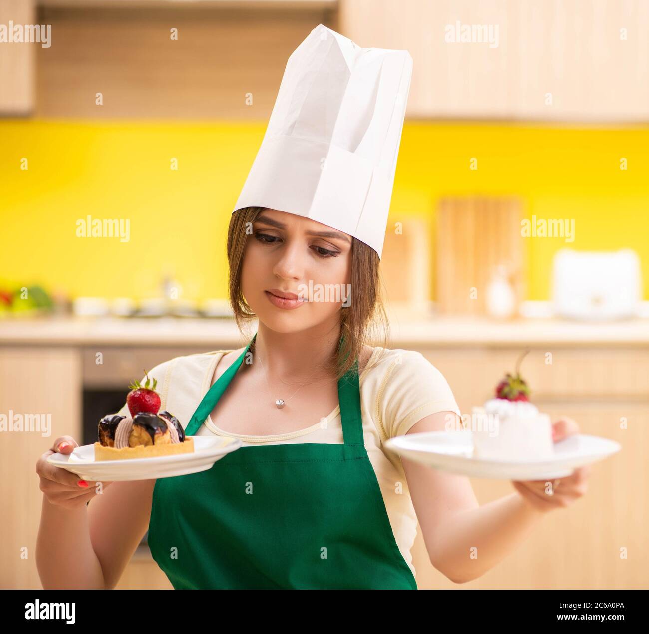 The young cook cooking cakes in the kitchen Stock Photo - Alamy