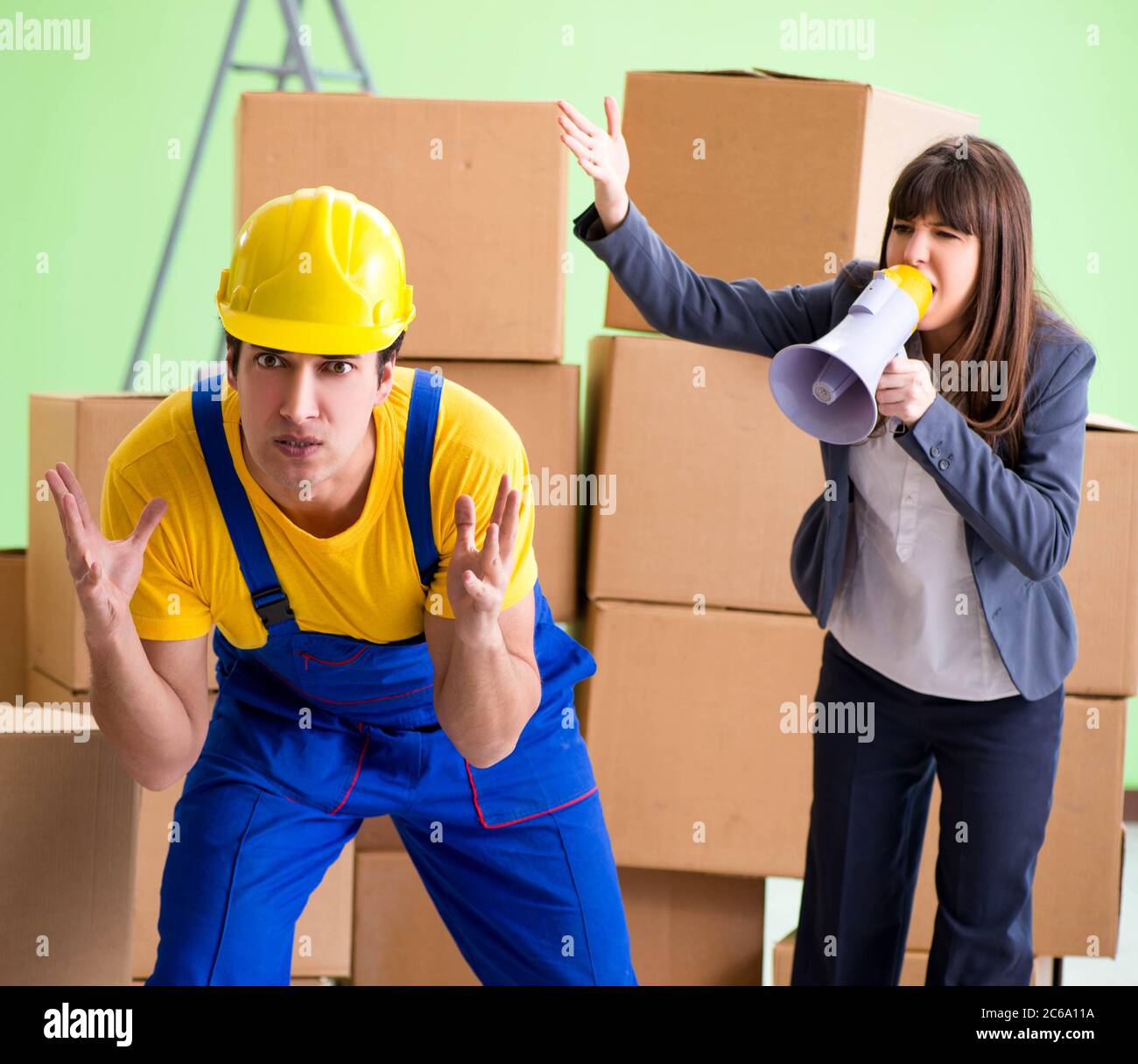 The woman boss and man contractor working with boxes delivery Stock ...