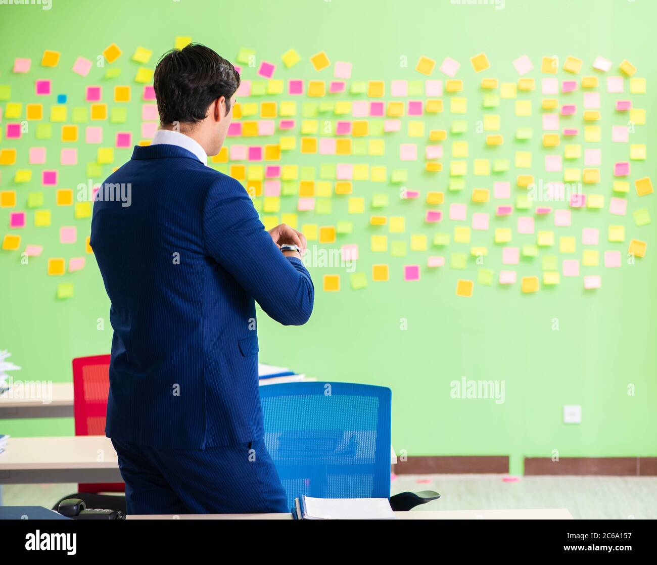 The businessman with many conflicting priorities Stock Photo - Alamy