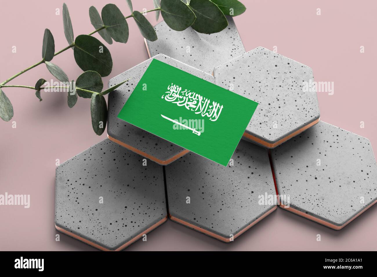 Saudi Arabia flag on hexagon stylish stones. Pink copy space background ...