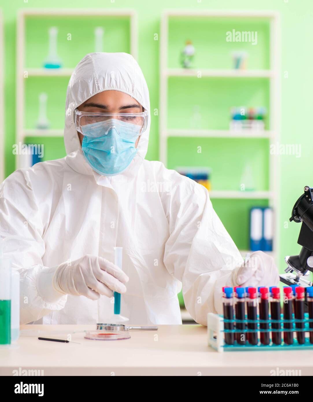 The chemist working in the lab on new experiment Stock Photo - Alamy