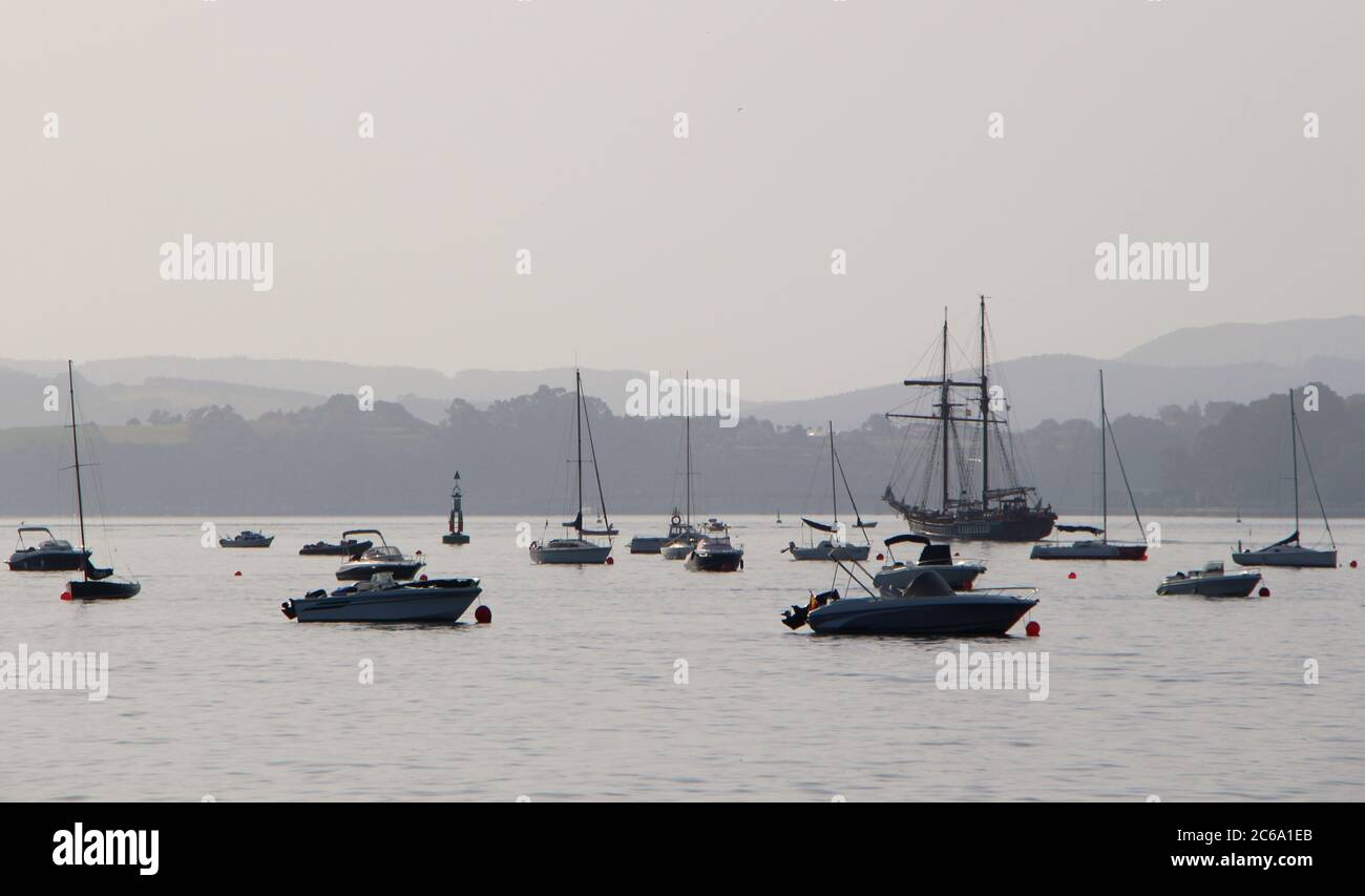 The tall ship Atyla training ship heading out to sea from the bay in ...